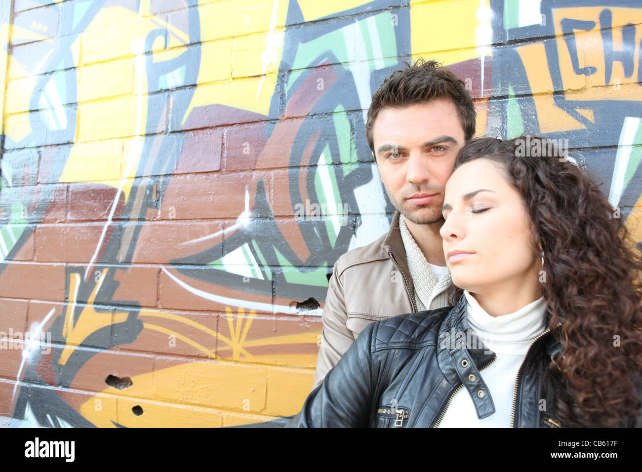 Models posing against wall Stock Photo - Alamy