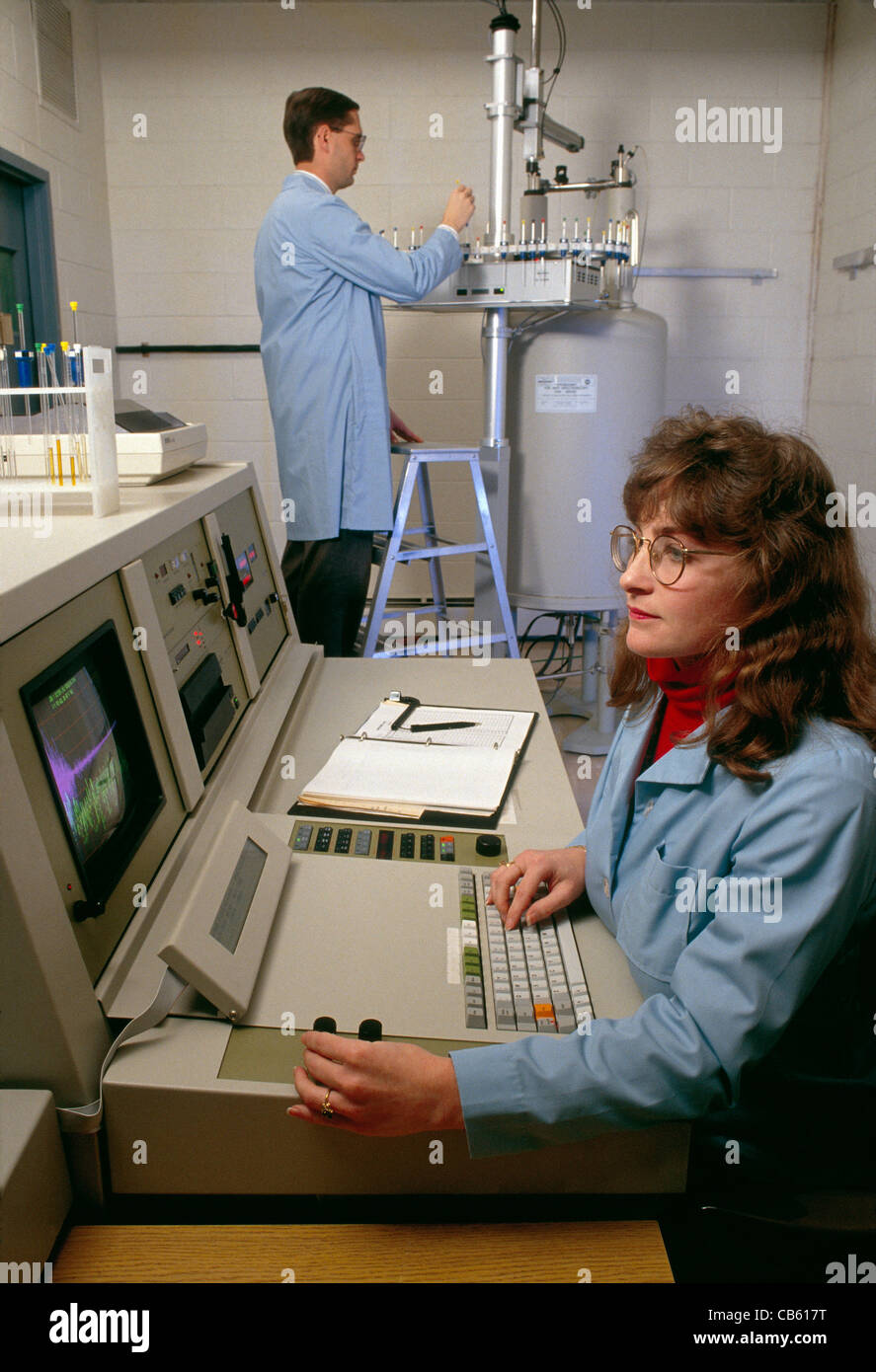 Scientists using laboratory equipment, research & development lab ...