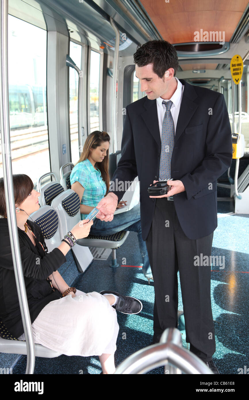 ticket collector in tramway Stock Photo - Alamy