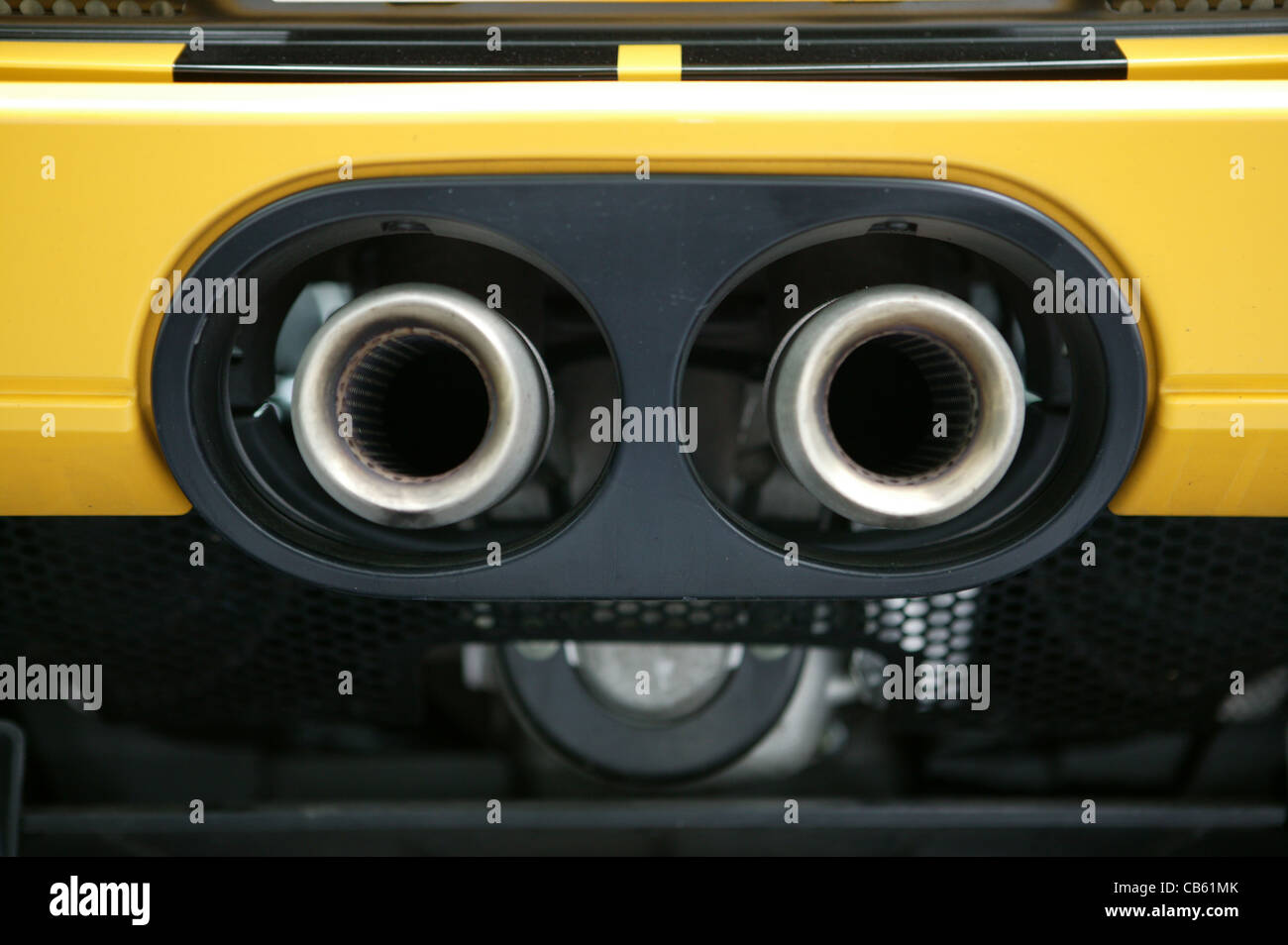 Yellow GT40 exhaust pipes detail Stock Photo - Alamy