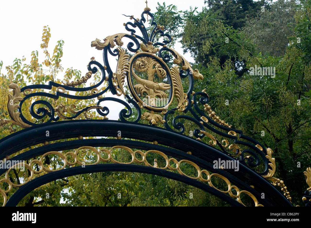 Decorative metalwork over entrance gate to the Jardins de la Fontaine ...