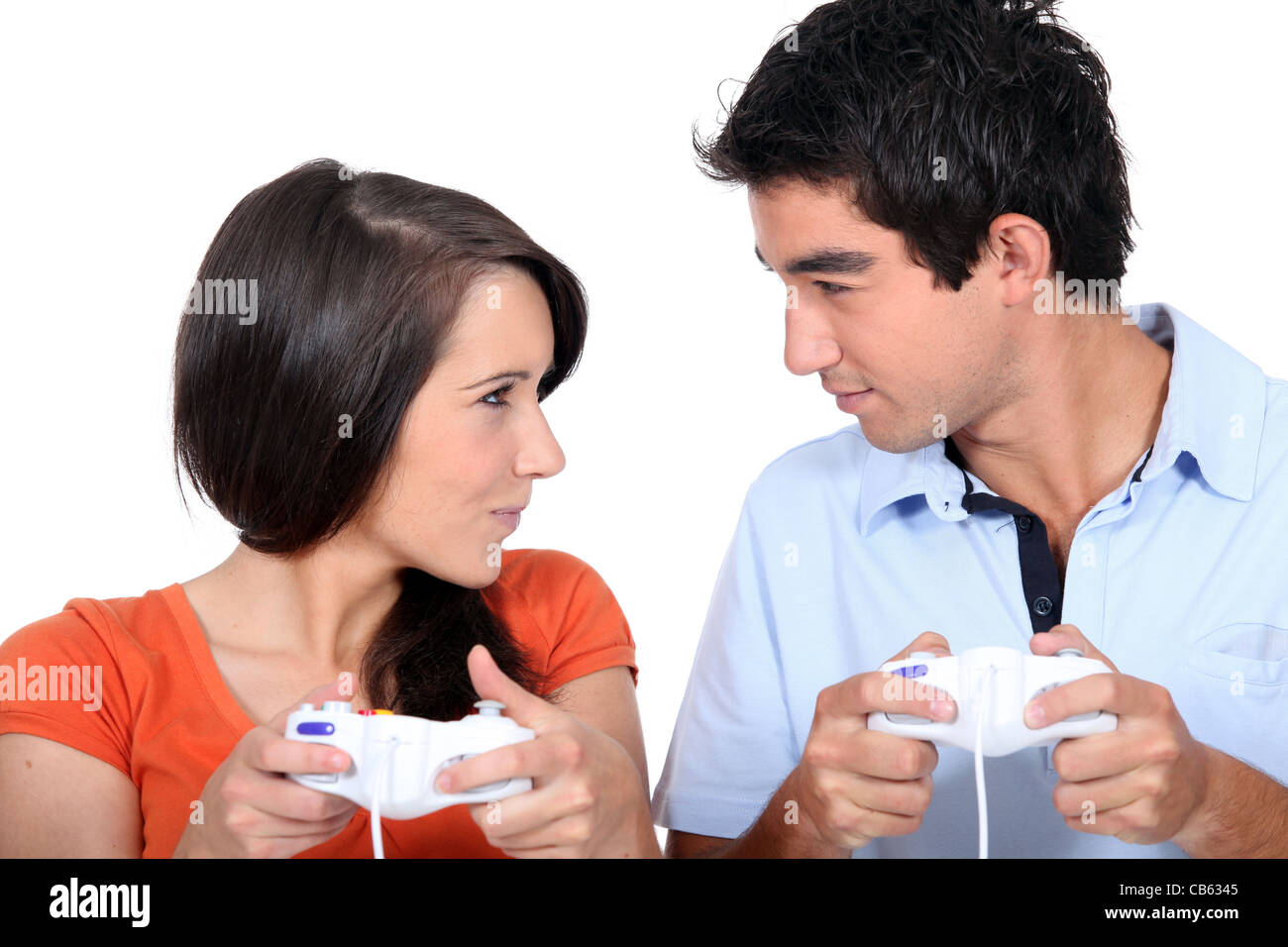 Two young people playing computer games Stock Photo - Alamy