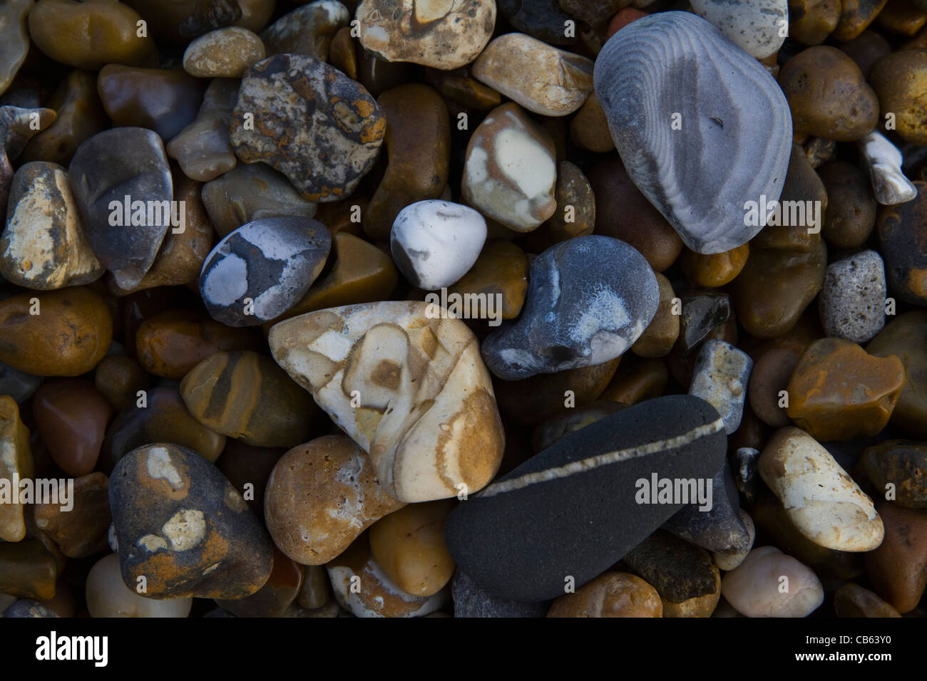 Colourful pebbles with a variety of patterns Stock Photo - Alamy