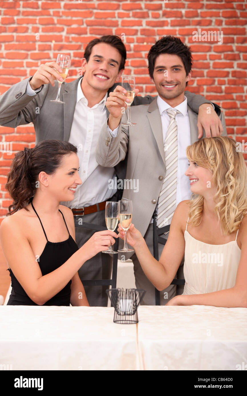 Friends making a toast Stock Photo - Alamy