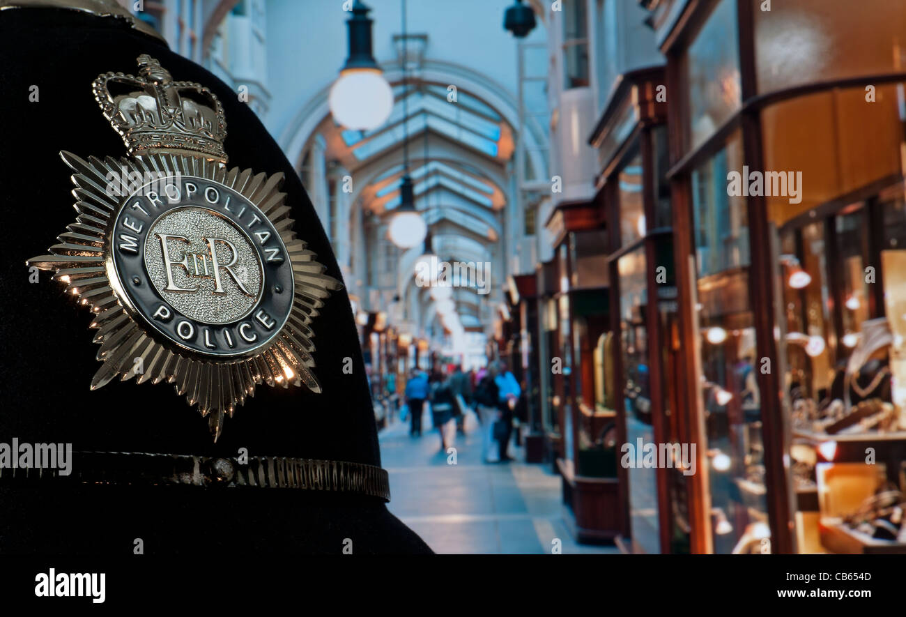Close view on Metropolitan Police helmet with The Piccadilly Arcade ...
