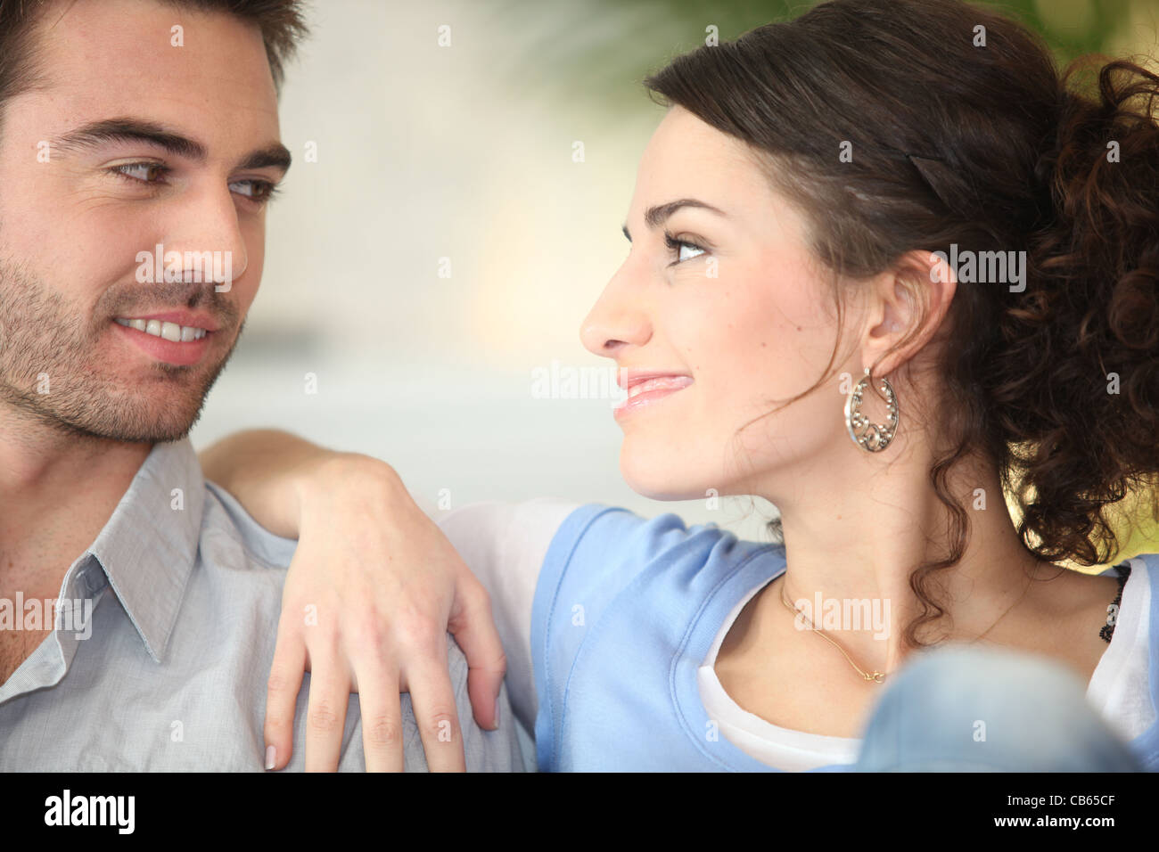 Loving couple sitting hugged hi-res stock photography and images - Alamy