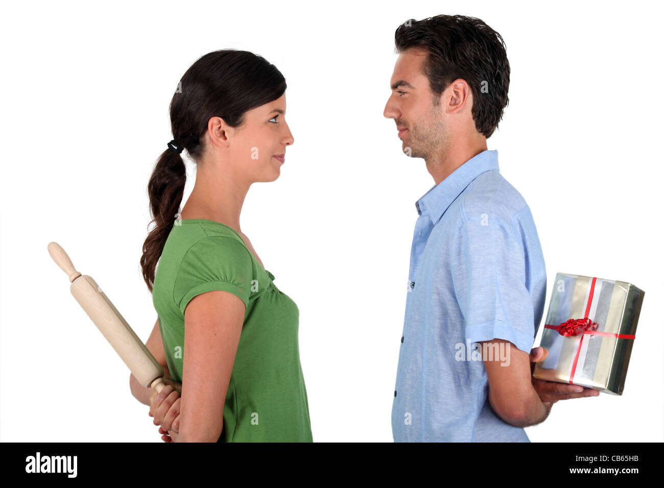 Couple stood facing each other Stock Photo - Alamy