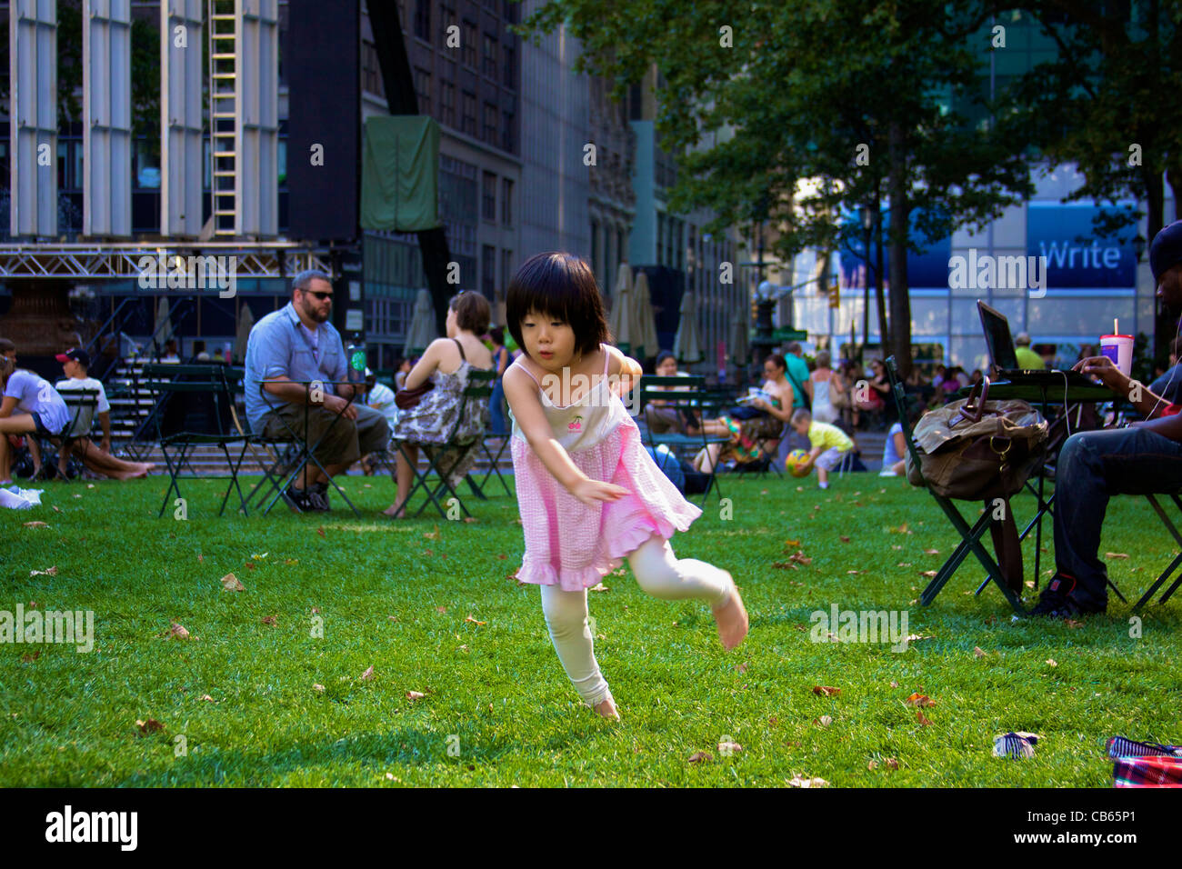 Little Asian girl frolics on a sunny afternoon Stock Photo - Alamy