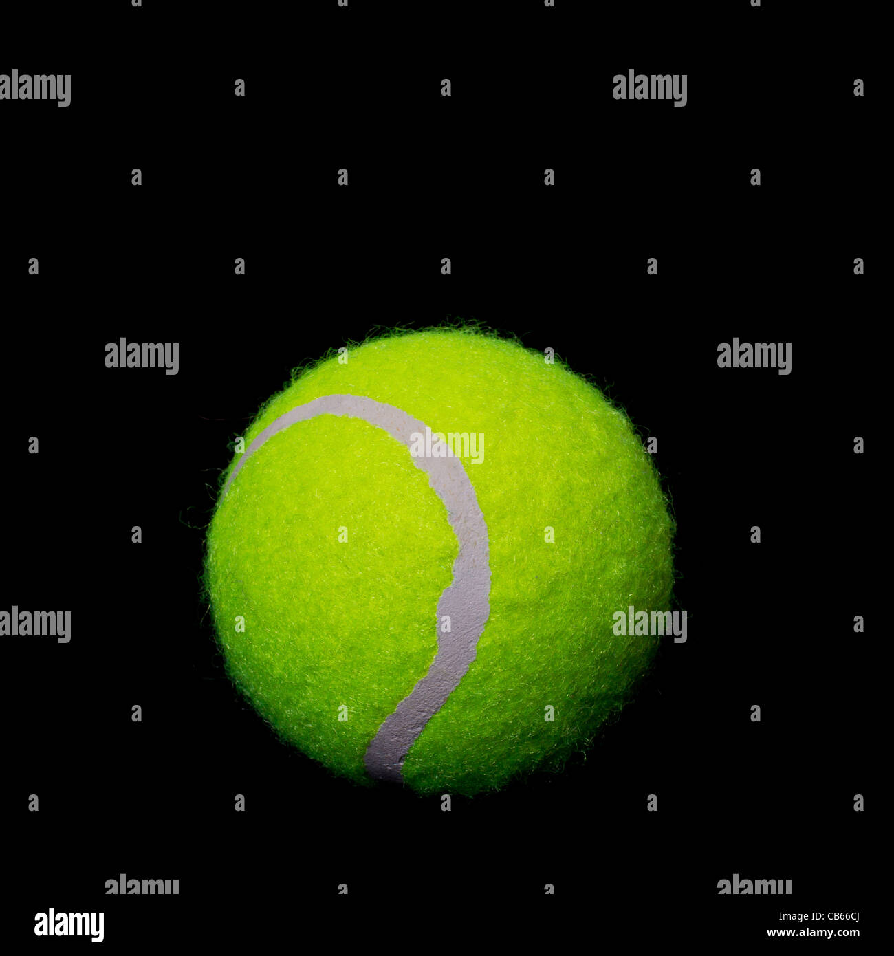 Tennis ball on a black background Stock Photo - Alamy