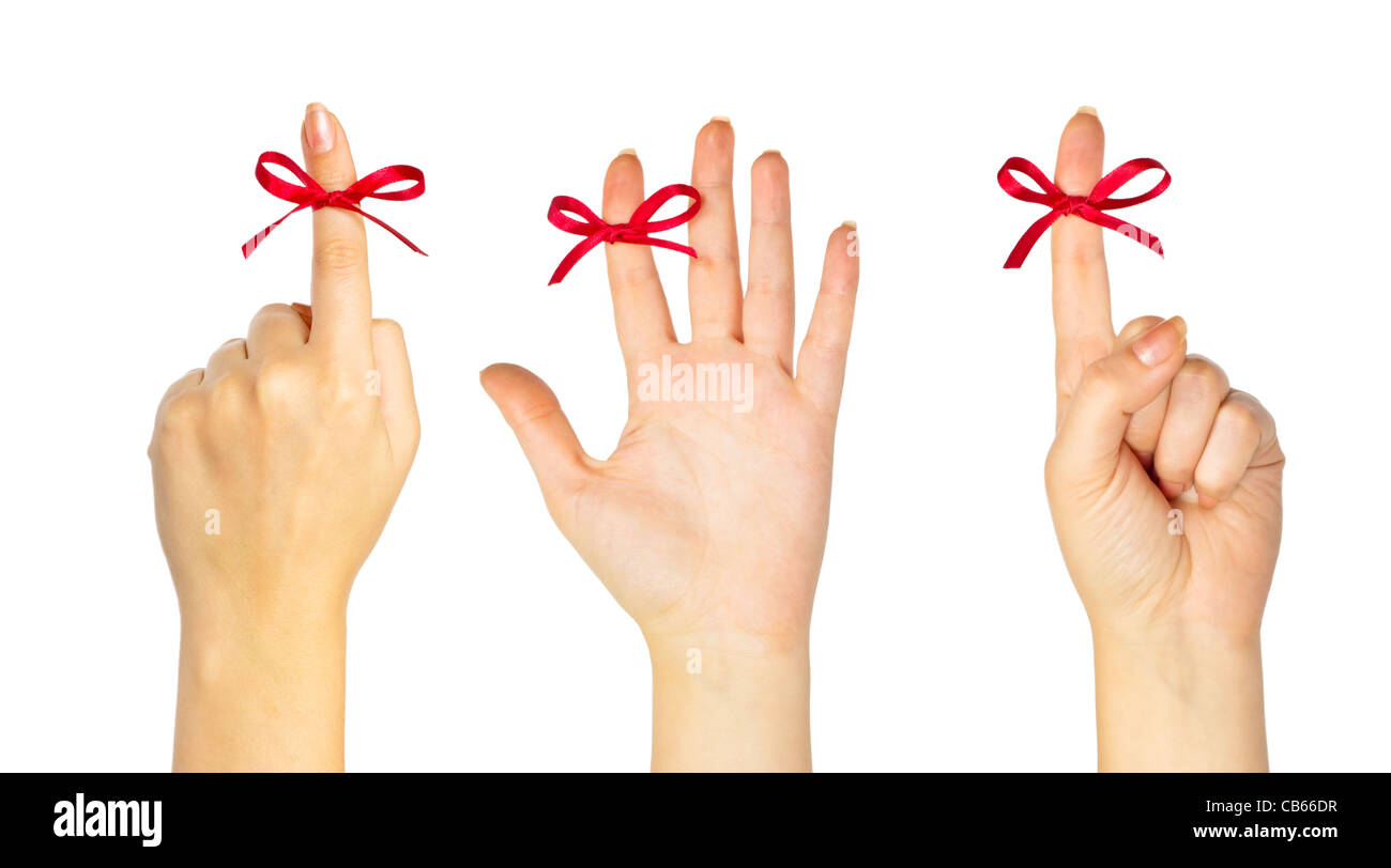 Red bow on finger isolated on white background Stock Photo - Alamy