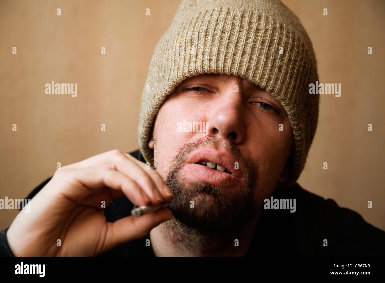 Hippie man smoking hi-res stock photography and images - Alamy