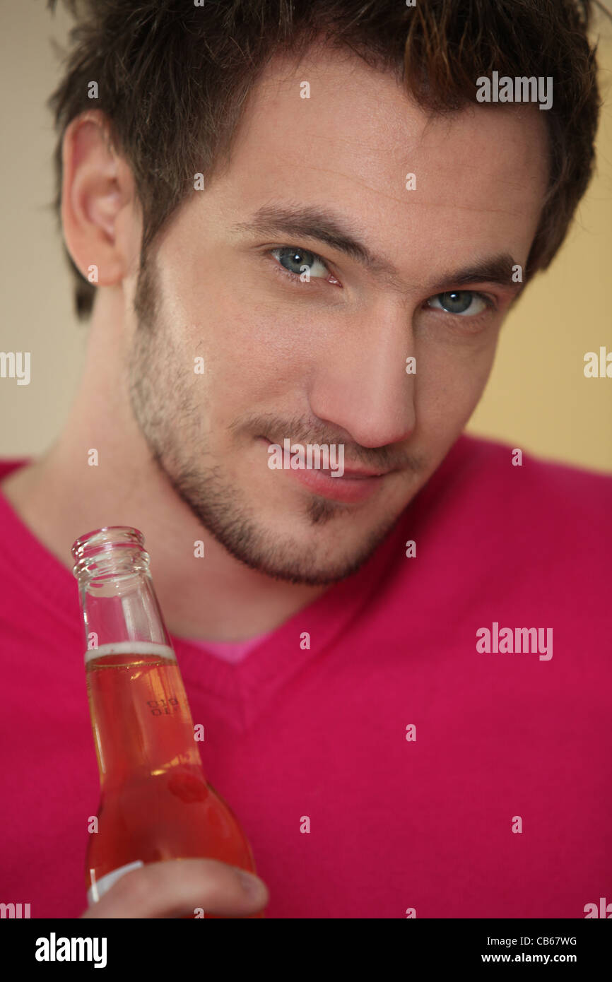 Man with bottle of beer Stock Photo - Alamy