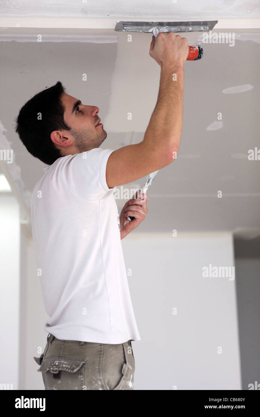 Man plastering ceiling Stock Photo - Alamy