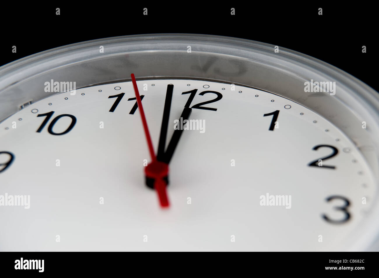 Clock detail view isolated on black Stock Photo - Alamy