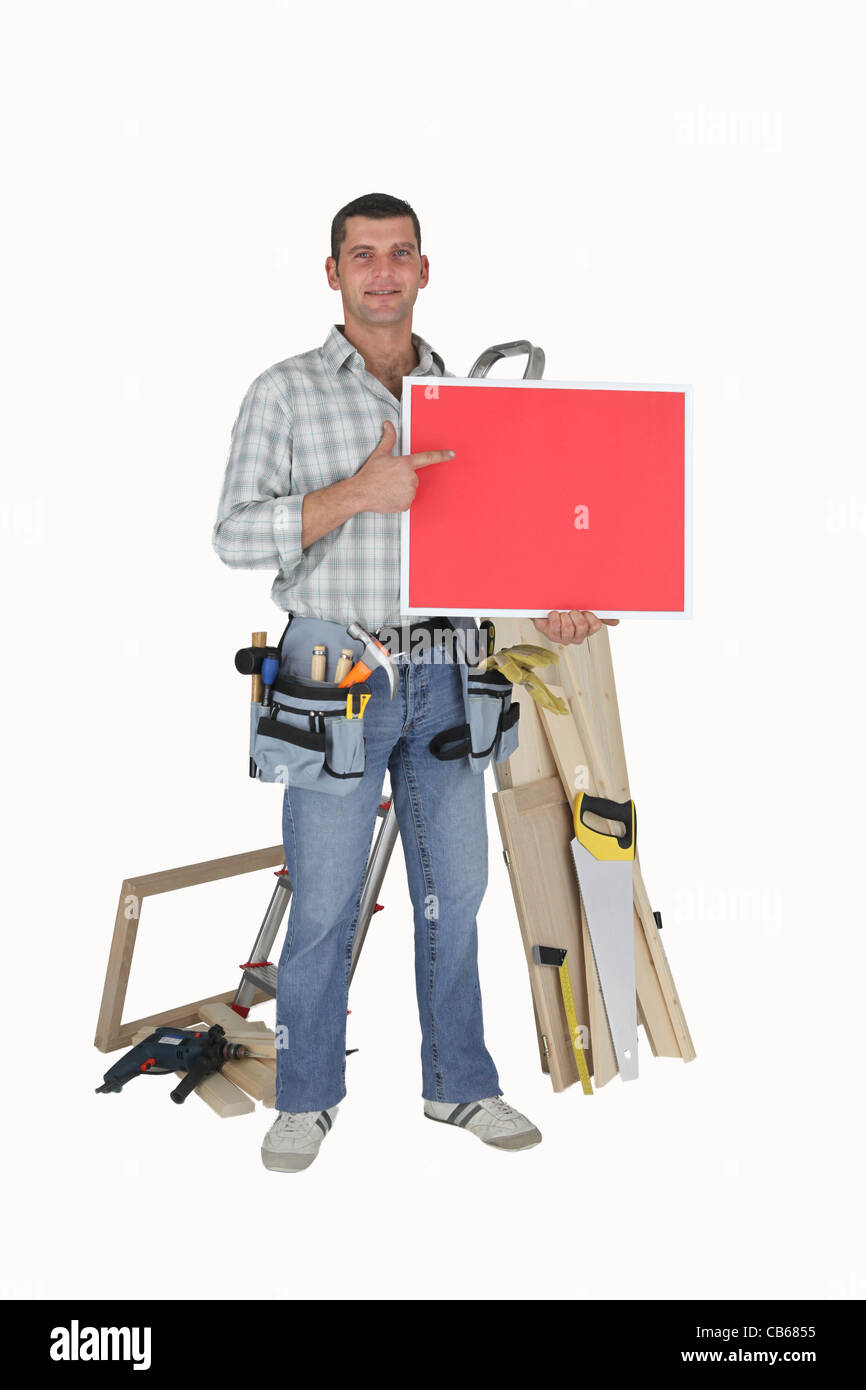 Mr. Fixit pointing to a red sign Stock Photo - Alamy