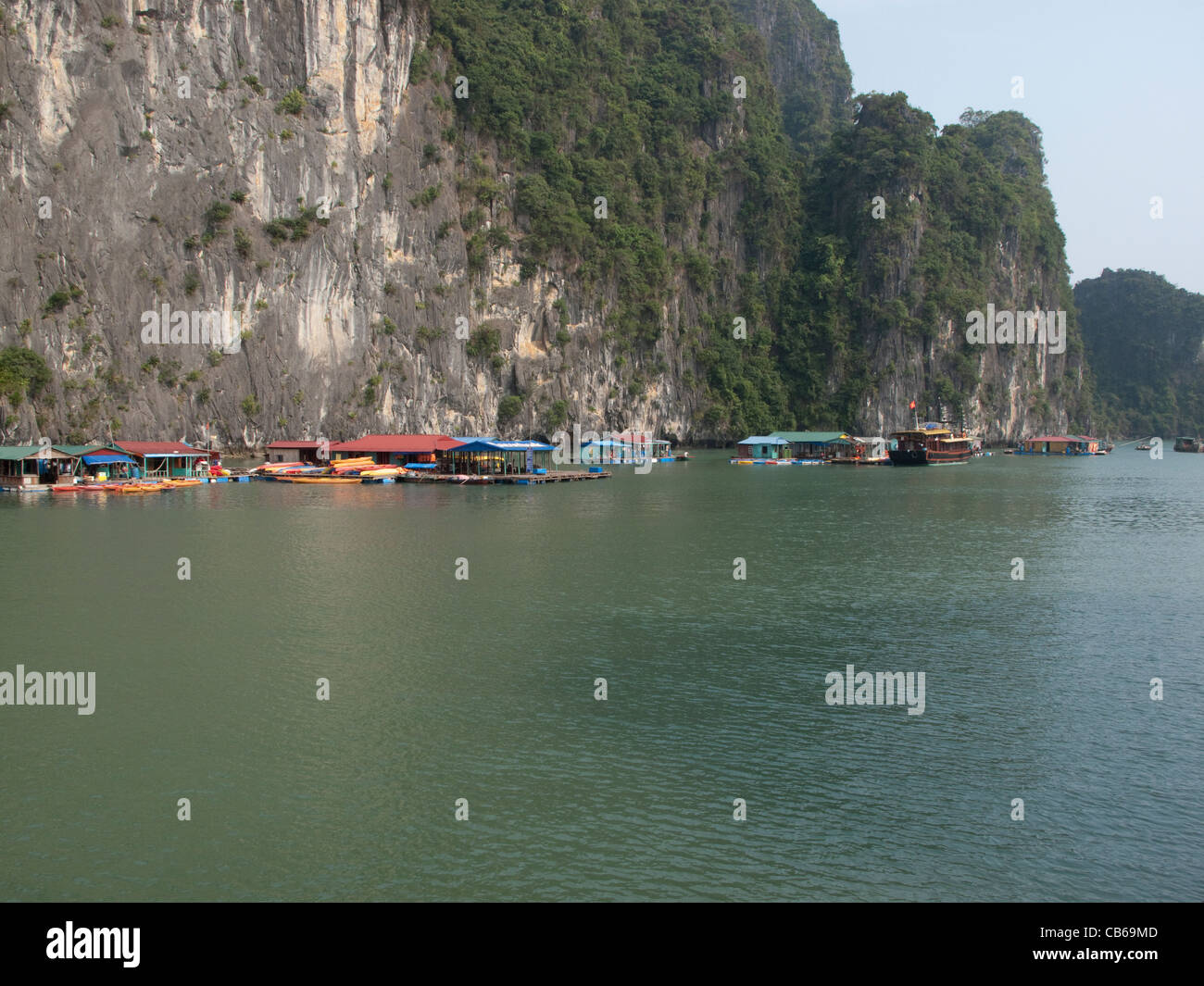 Floating village under vertical sea cliffs on the South China Sea in ...