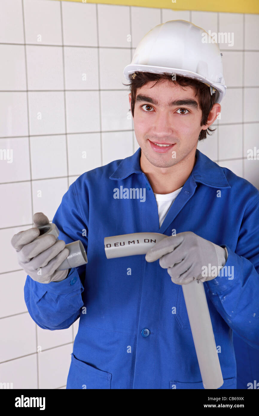 portrait of young apprentice handling u turn Stock Photo - Alamy