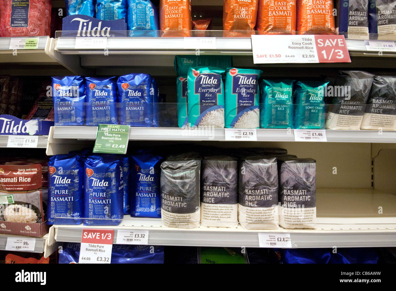 Rice for sale on a Waitrose supermarket shelf, UK Stock Photo - Alamy