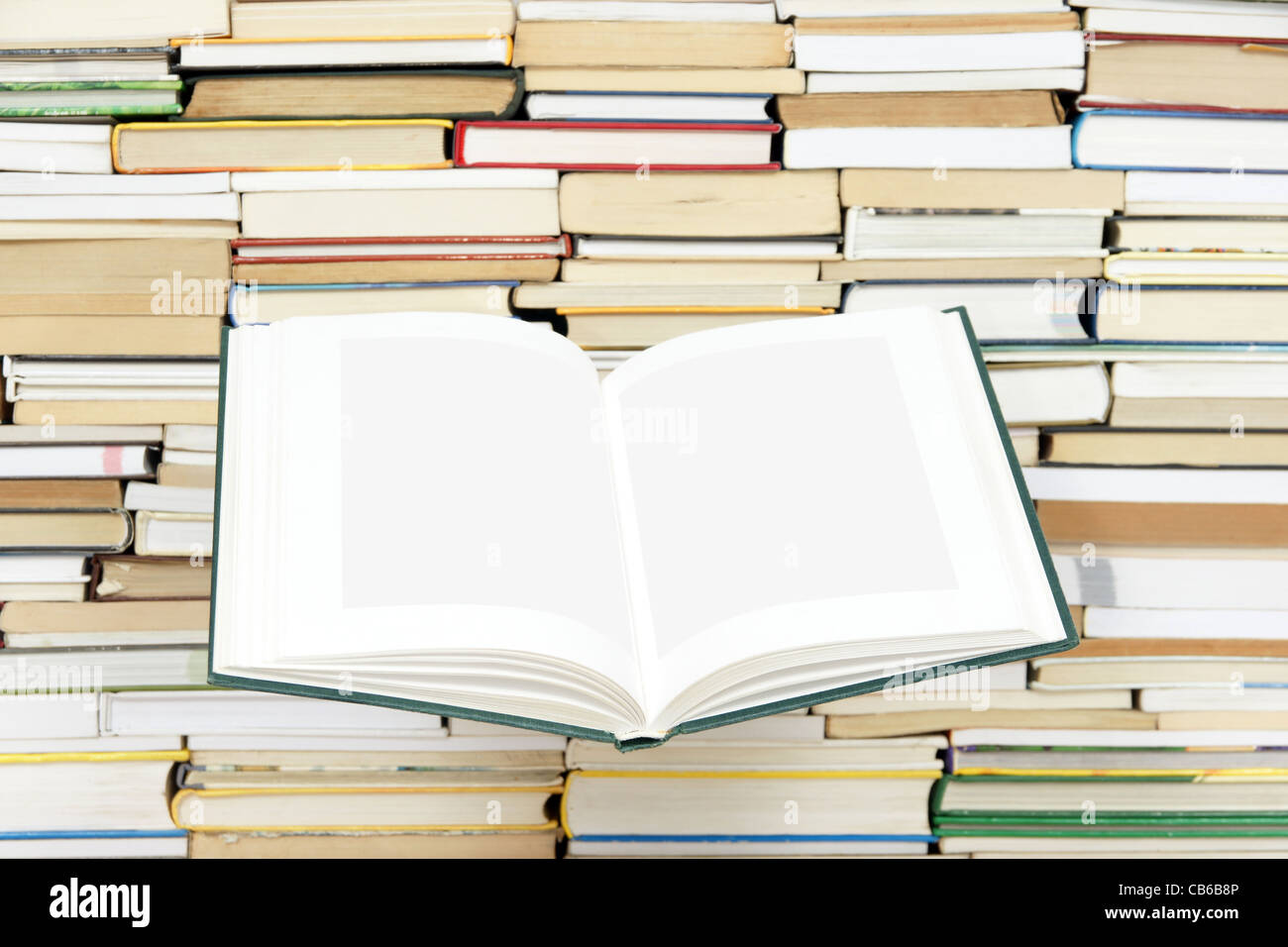 open book on background of arranged books Stock Photo - Alamy