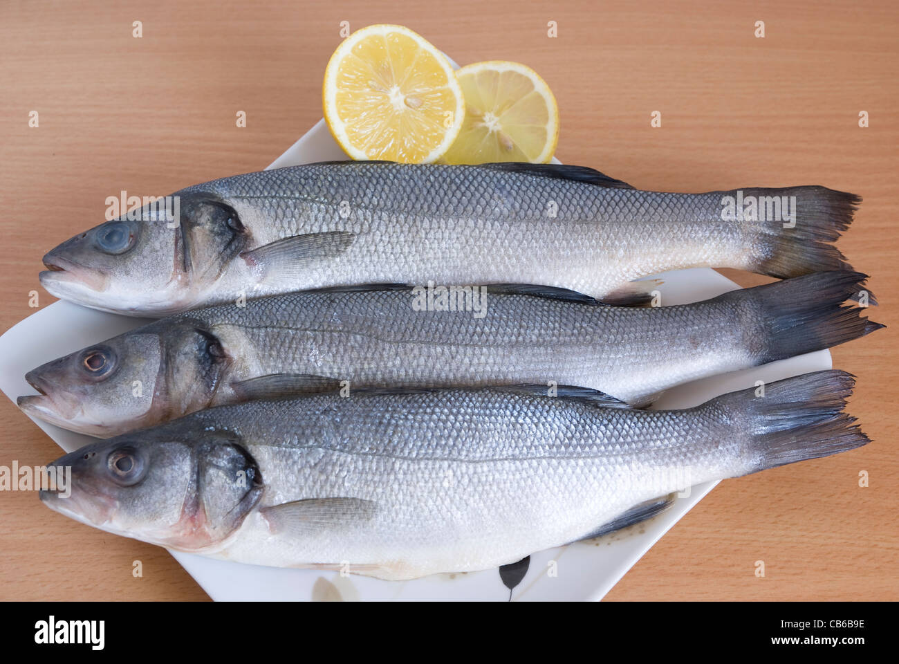 Whole Raw Fish On Plate High Resolution Stock Photography and Images ...