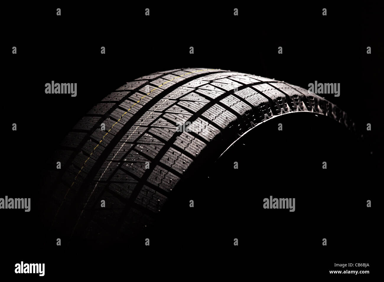 Brand new car tyre. Isolated on a white backgrond Stock Photo - Alamy