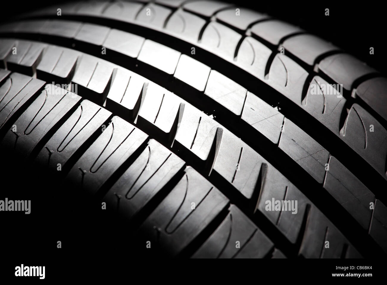 Modern high-performance sport summer tire close-up. Low key scene Stock ...