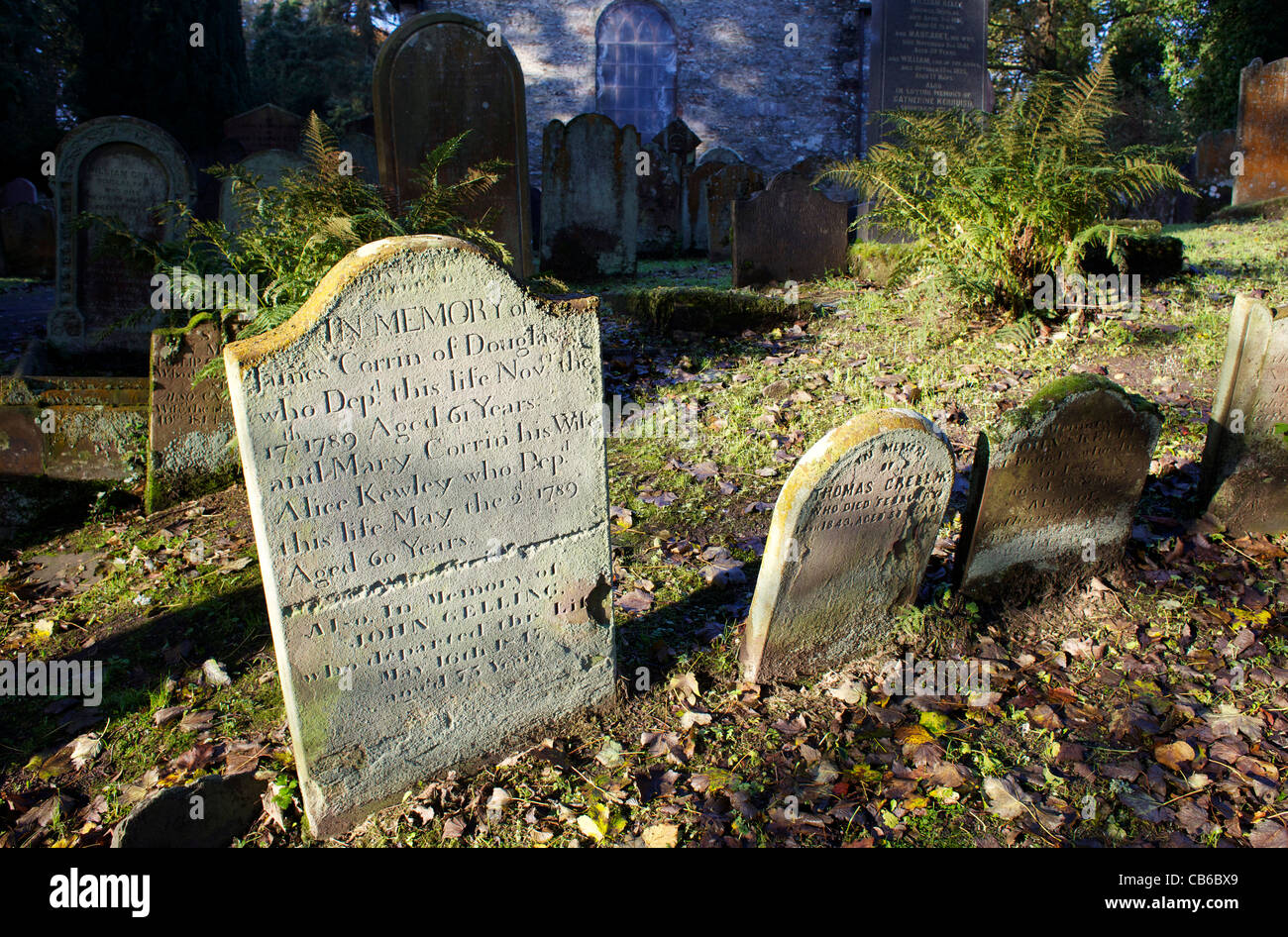 Strong side lighting and gravestone lettering Stock Photo - Alamy