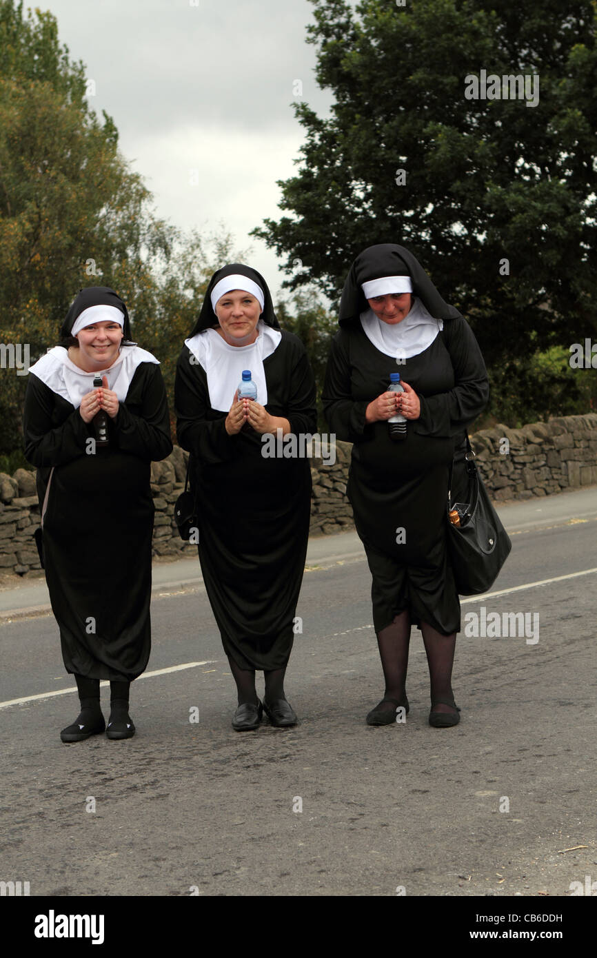 Three women dressed up in nun costumes during Barlow Carnival parade in ...