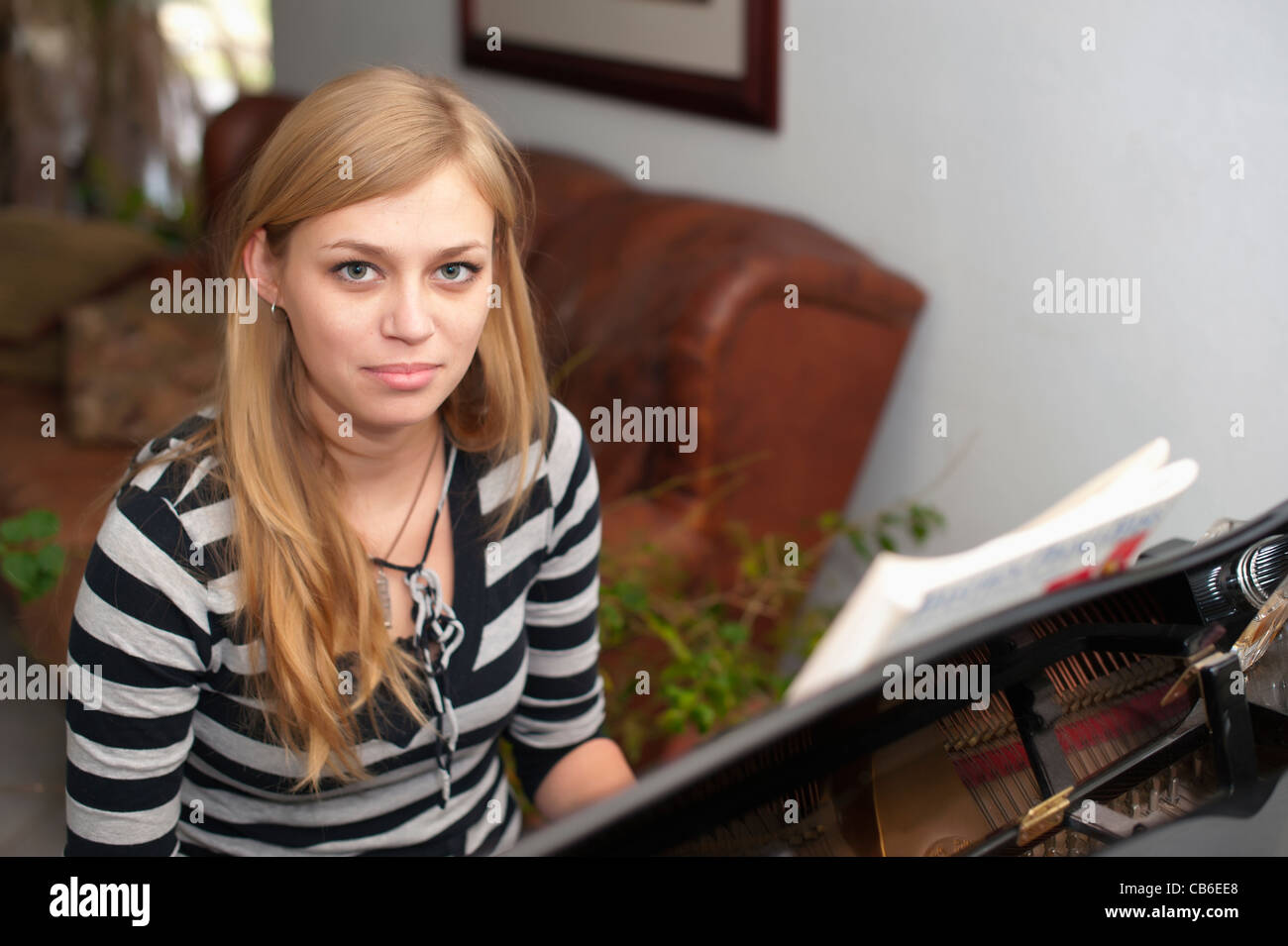 Female piano player Stock Photo - Alamy