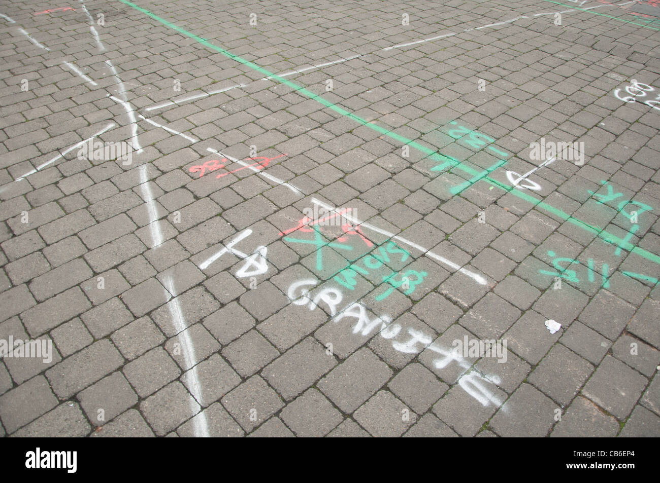 pavement marked out to identify underground services Stock Photo - Alamy