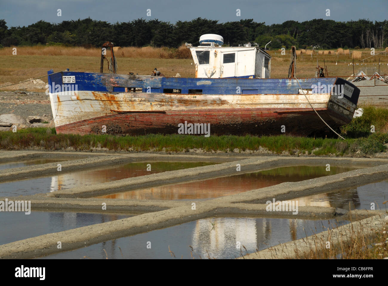 Derelict fishing boat placed in the Marais salant, the salt gardens of ...