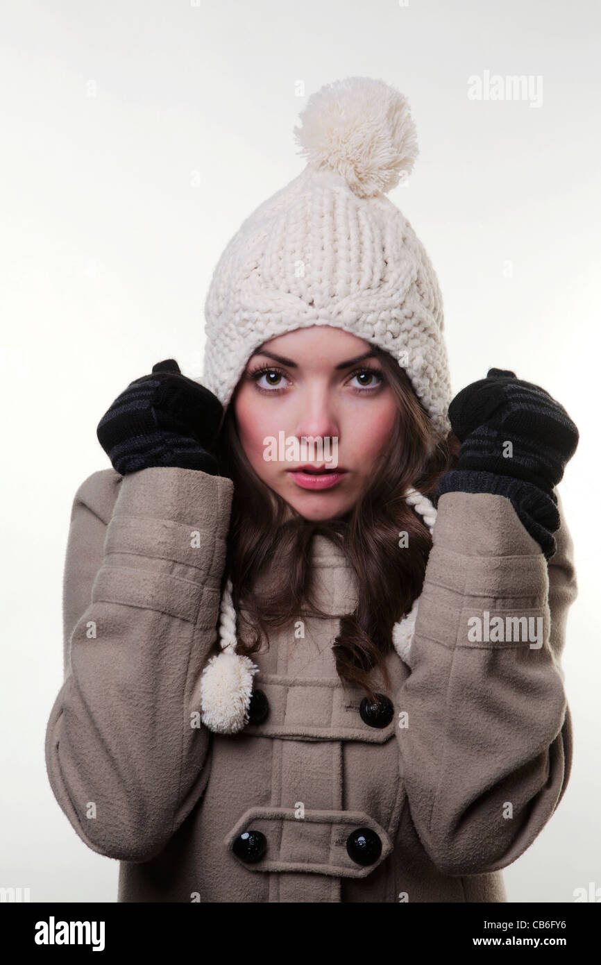 woman photographed in a hat a coat looking cold and ready for the ...