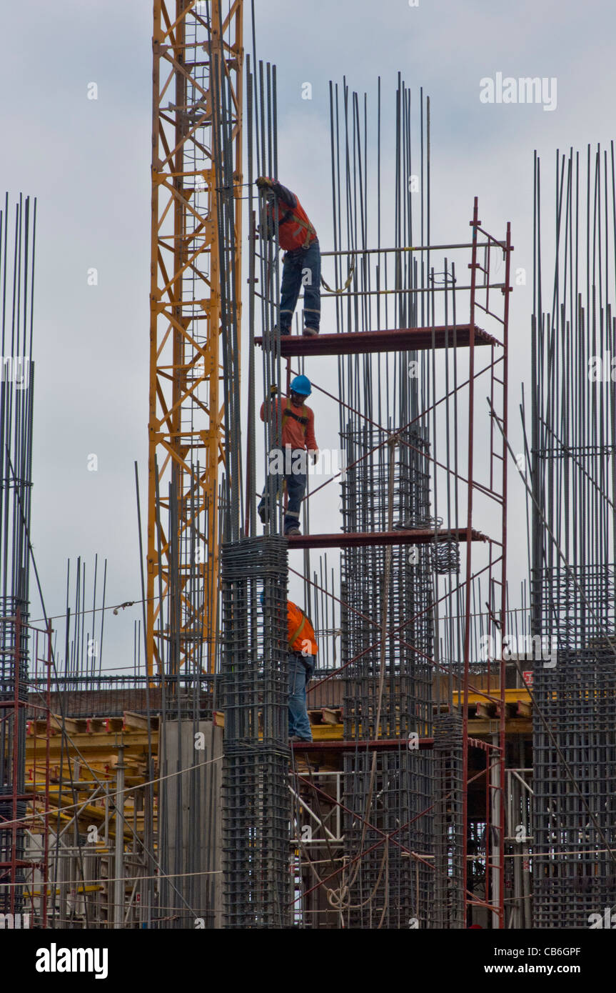 three construction workers at a site in Lima Stock Photo - Alamy