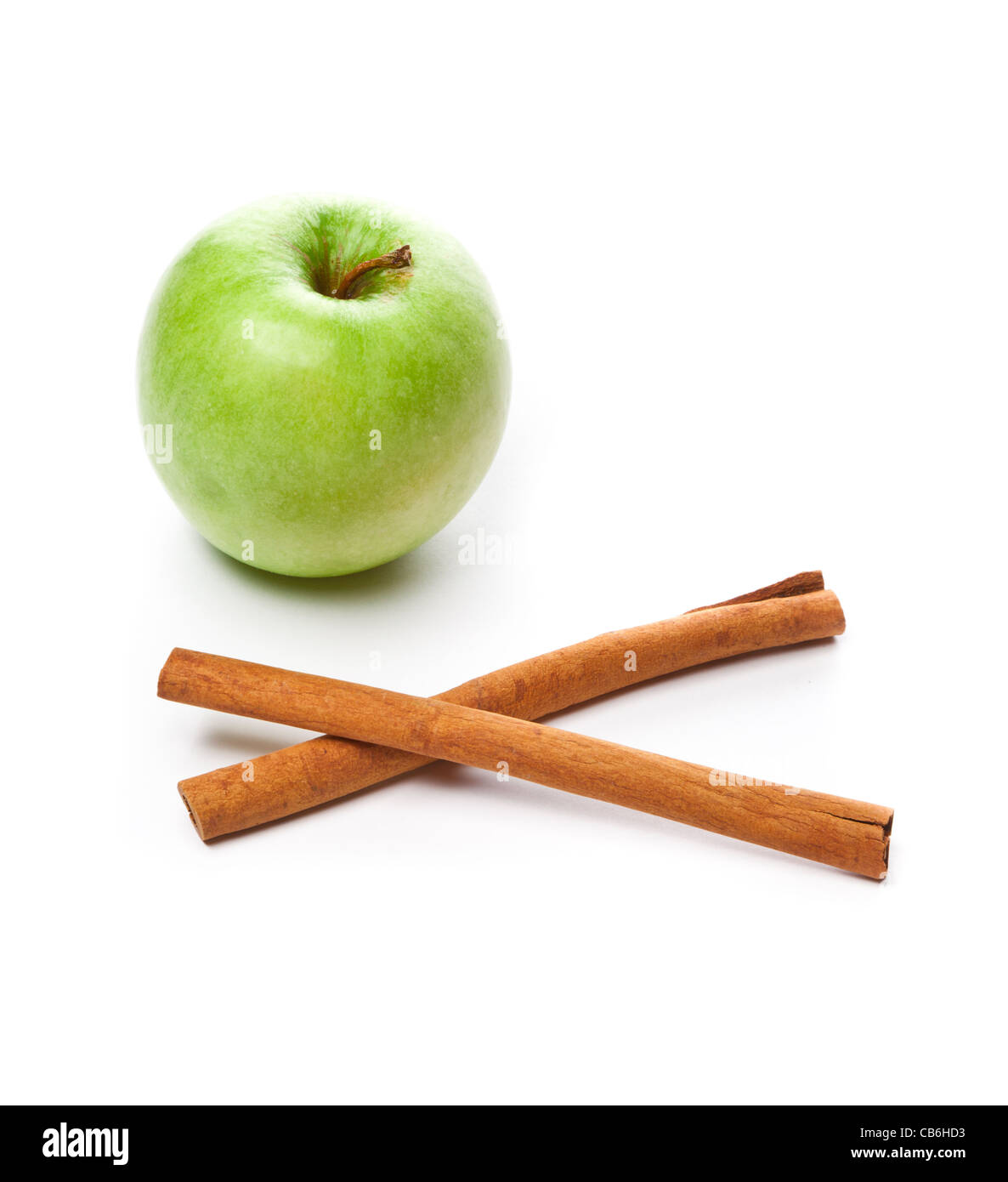 Picture of green apple and cinnamon isolated on white Stock Photo - Alamy