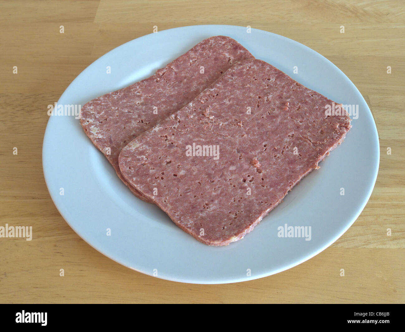 Slices of Corned Beef on a White Plate Stock Photo - Alamy