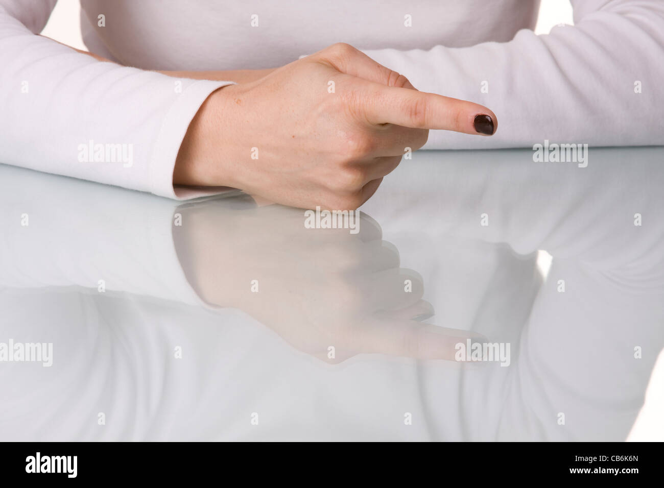 woman pointing finger with reflection Stock Photo - Alamy