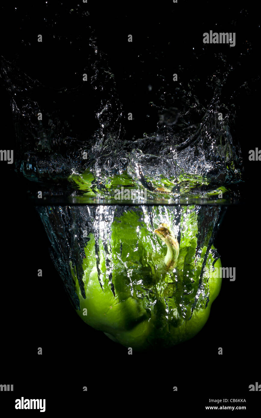 Drowning green pepperoni Stock Photo - Alamy