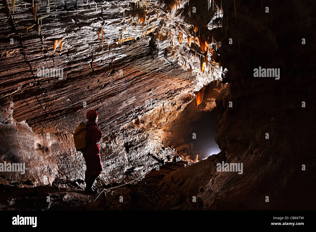 Caver in decorated passage Southern France Stock Photo - Alamy