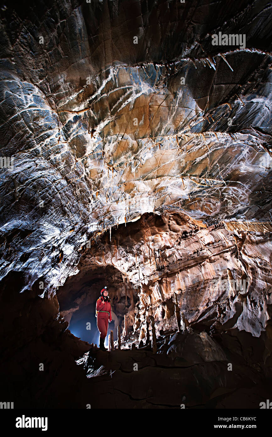 Caver in decorated passage Southern France Stock Photo - Alamy