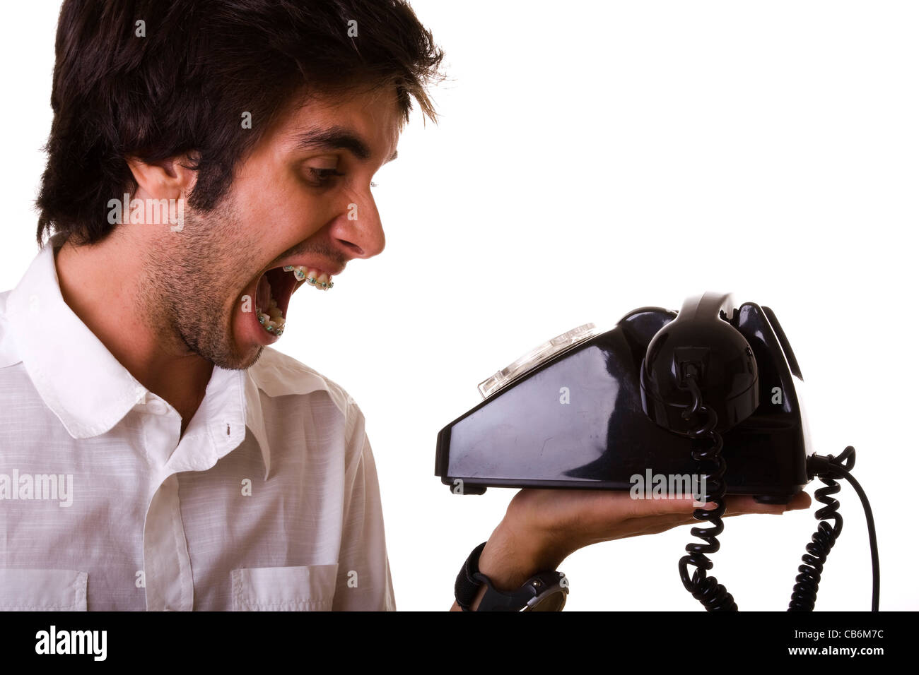 young men screaming to the telephone (isolated on white Stock Photo - Alamy