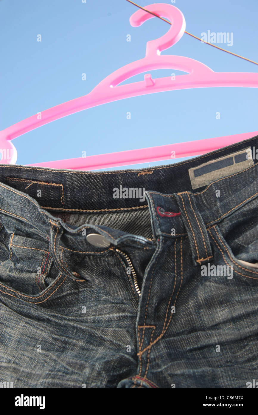 Denim jeans hanger hi-res stock photography and images - Alamy