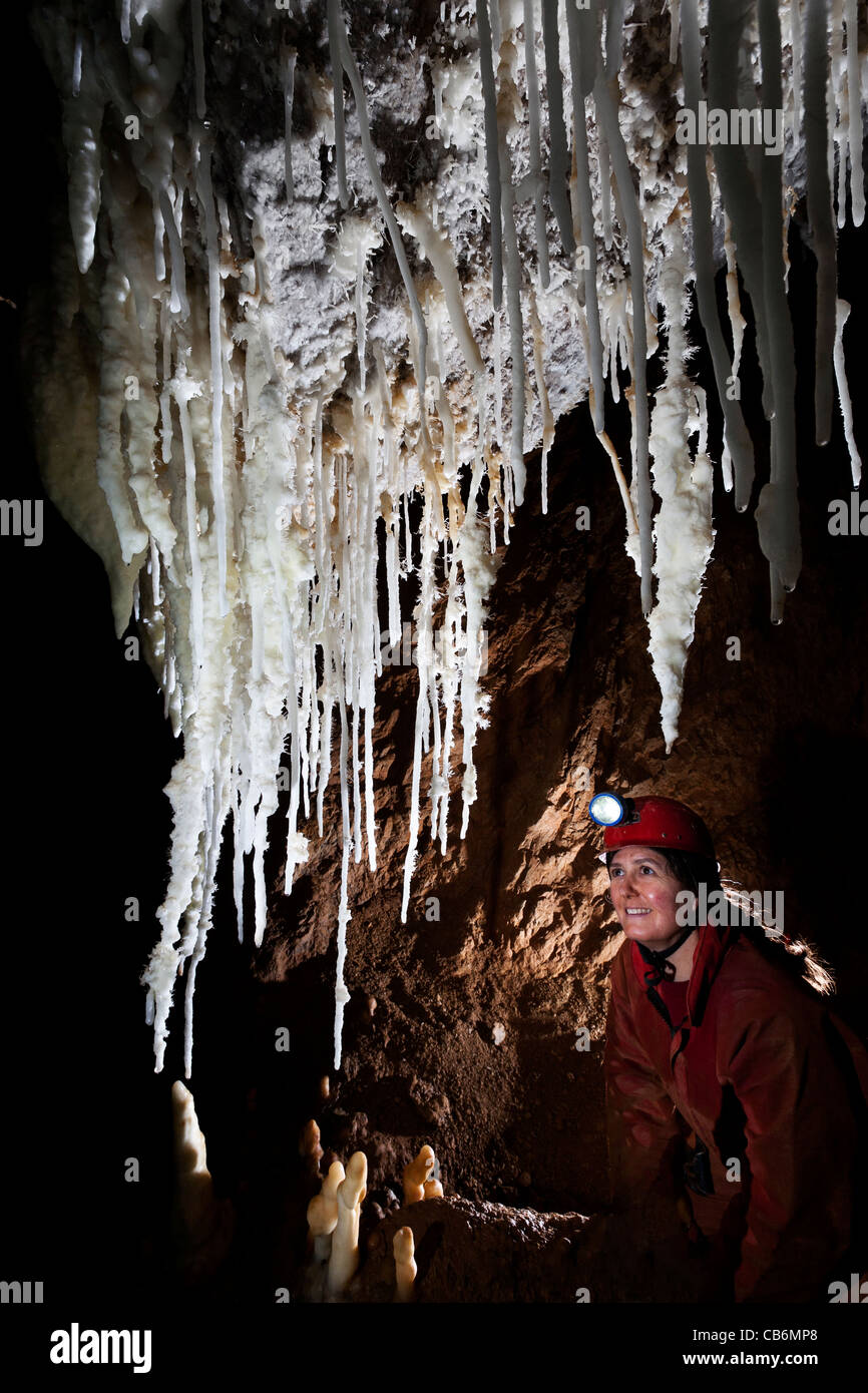 Female caver with stalactites in French cave Stock Photo - Alamy
