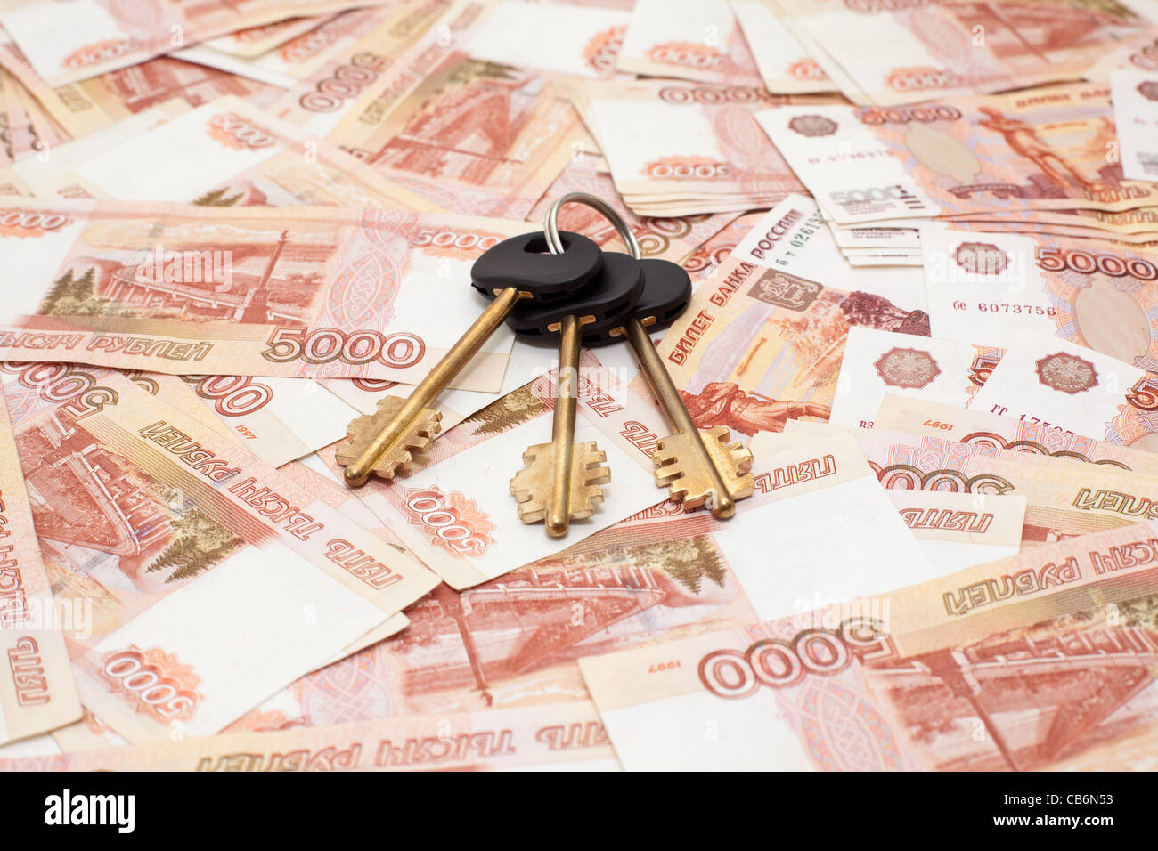 House keys on money. Russian cashnotes background Stock Photo - Alamy
