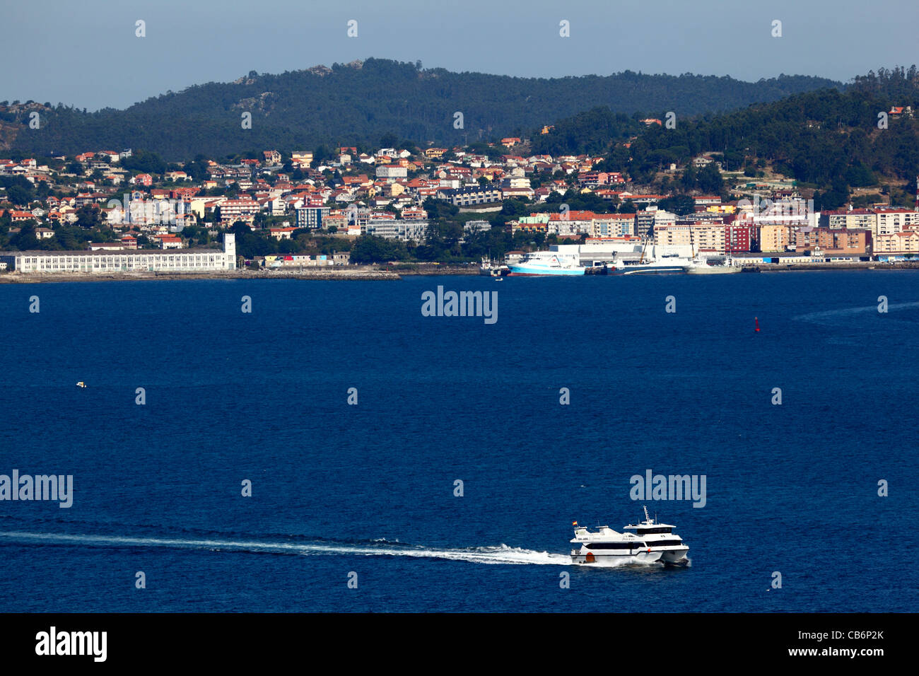 Cies Islands hydrofoil on Ria de Vigo , village of Cangas in background ...