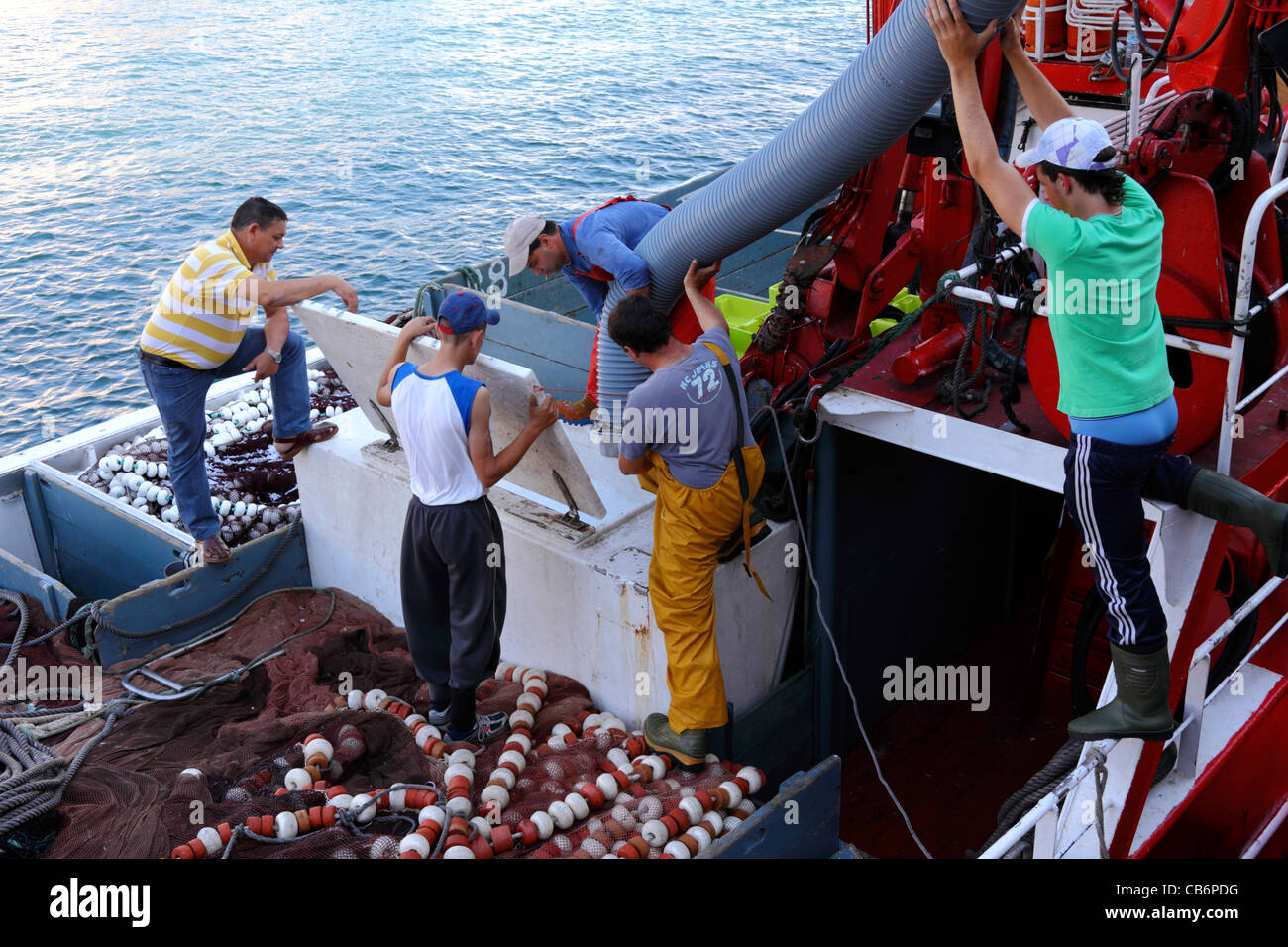 Nets filling boat hi-res stock photography and images - Alamy