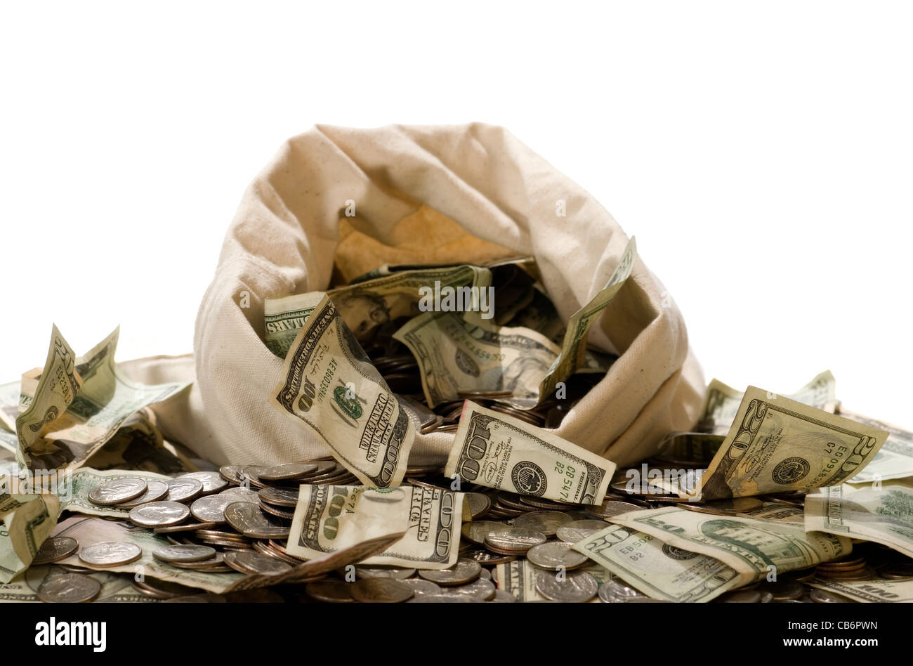Money (American Dollars) spilling from a canvas money bag Stock Photo ...