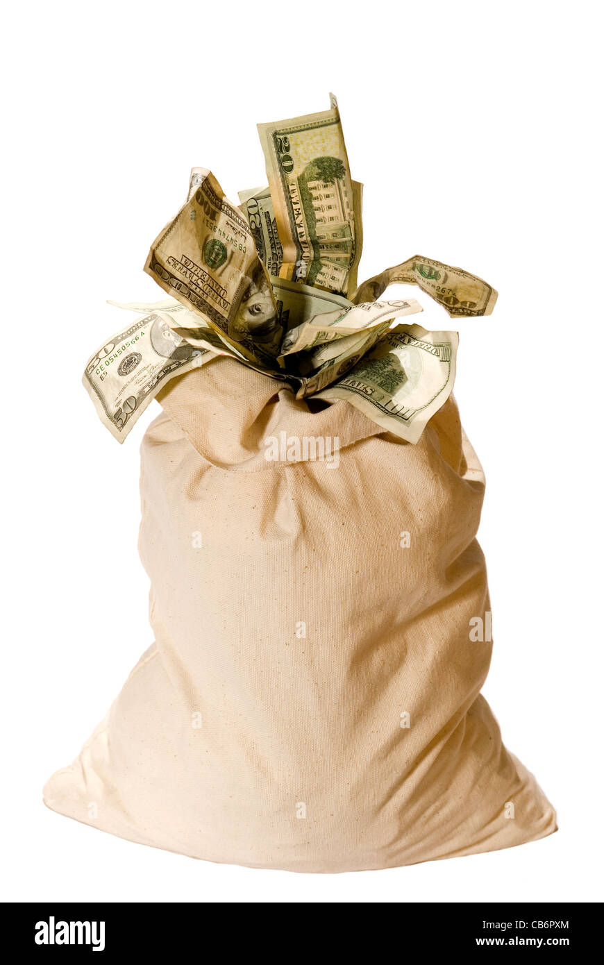Money (American Dollars) spilling from a canvas money bag Stock Photo ...
