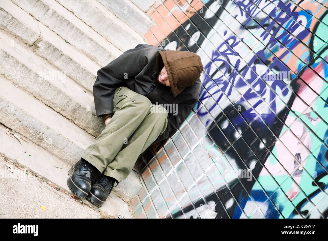 Homeless people sit outside hi-res stock photography and images - Alamy