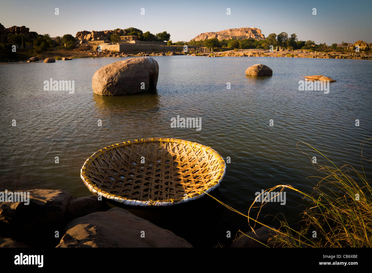 hampi ruins coracle river rocks water architecture Stock Photo - Alamy