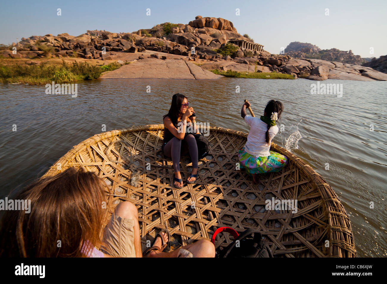 hampi ruins coracle asian paddle river adventure Stock Photo - Alamy